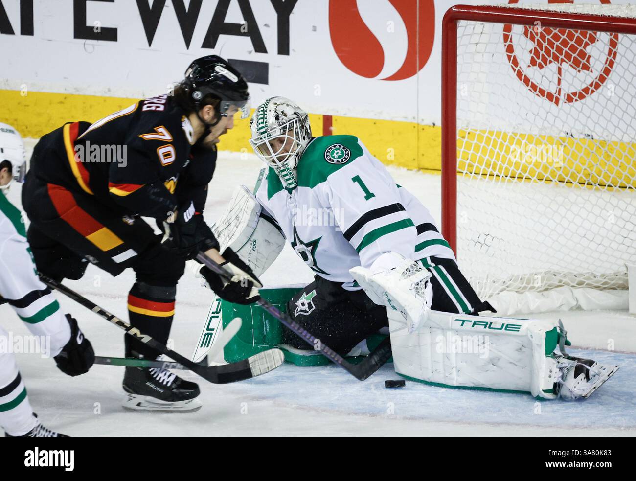 Dallas Stars goalie Casey DeSmith, right, blocks the net on Calgary ...