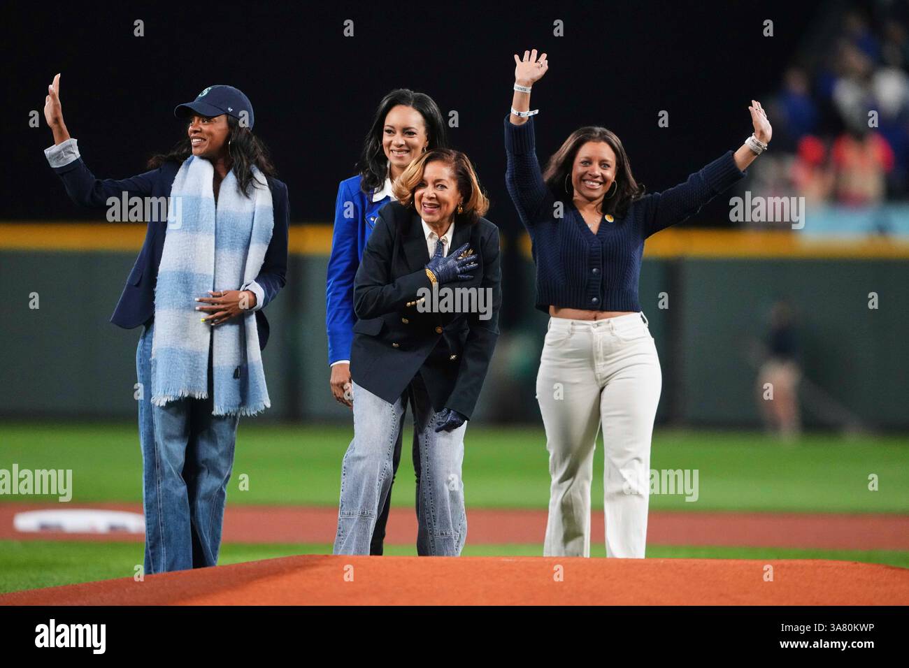 Rickey Henderson's wife Pamela Palmer, center, delivers the game ball ...