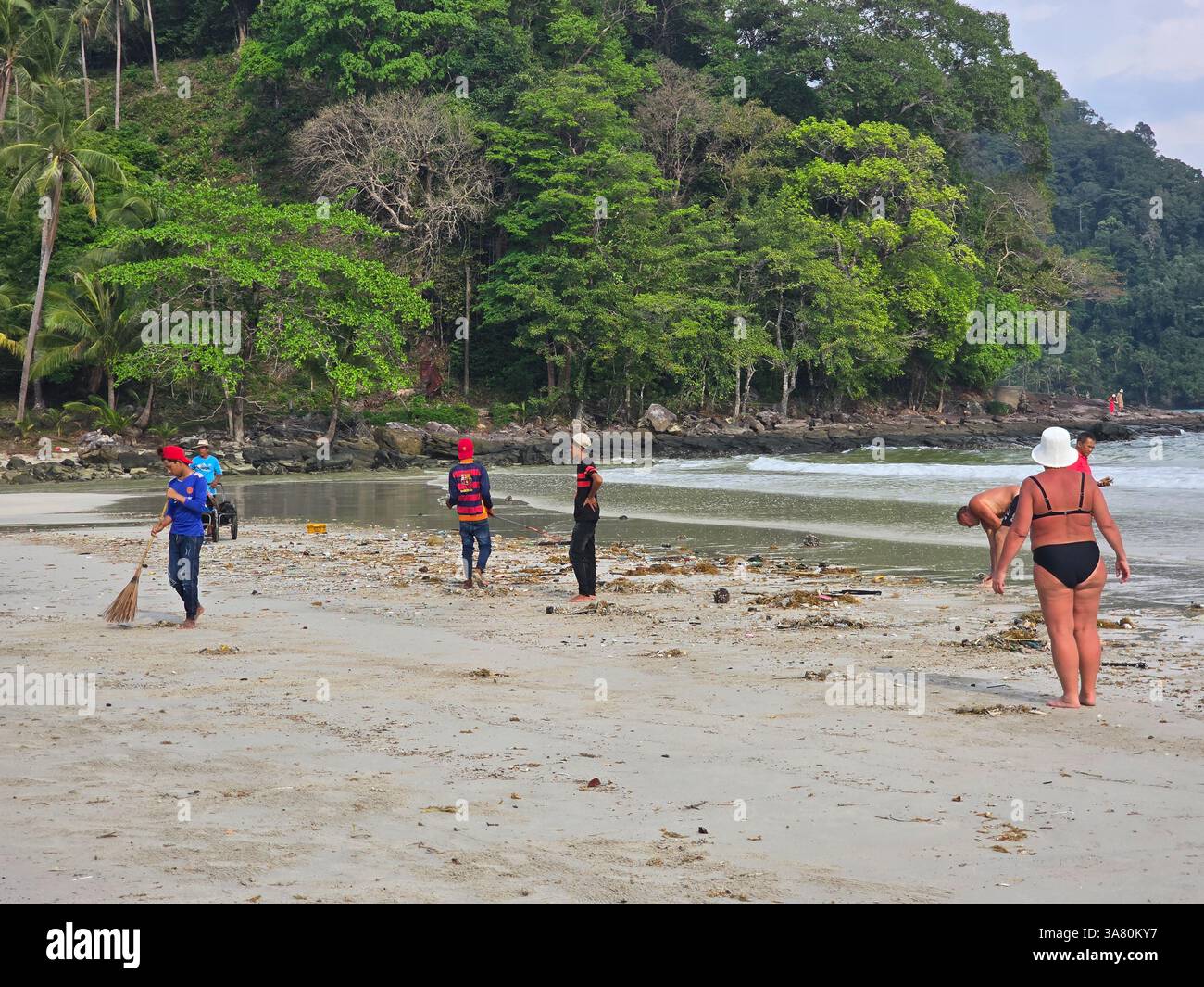 Koh Kood, Thailand, 13 March 2025, a group of dedicated volunteers work ...