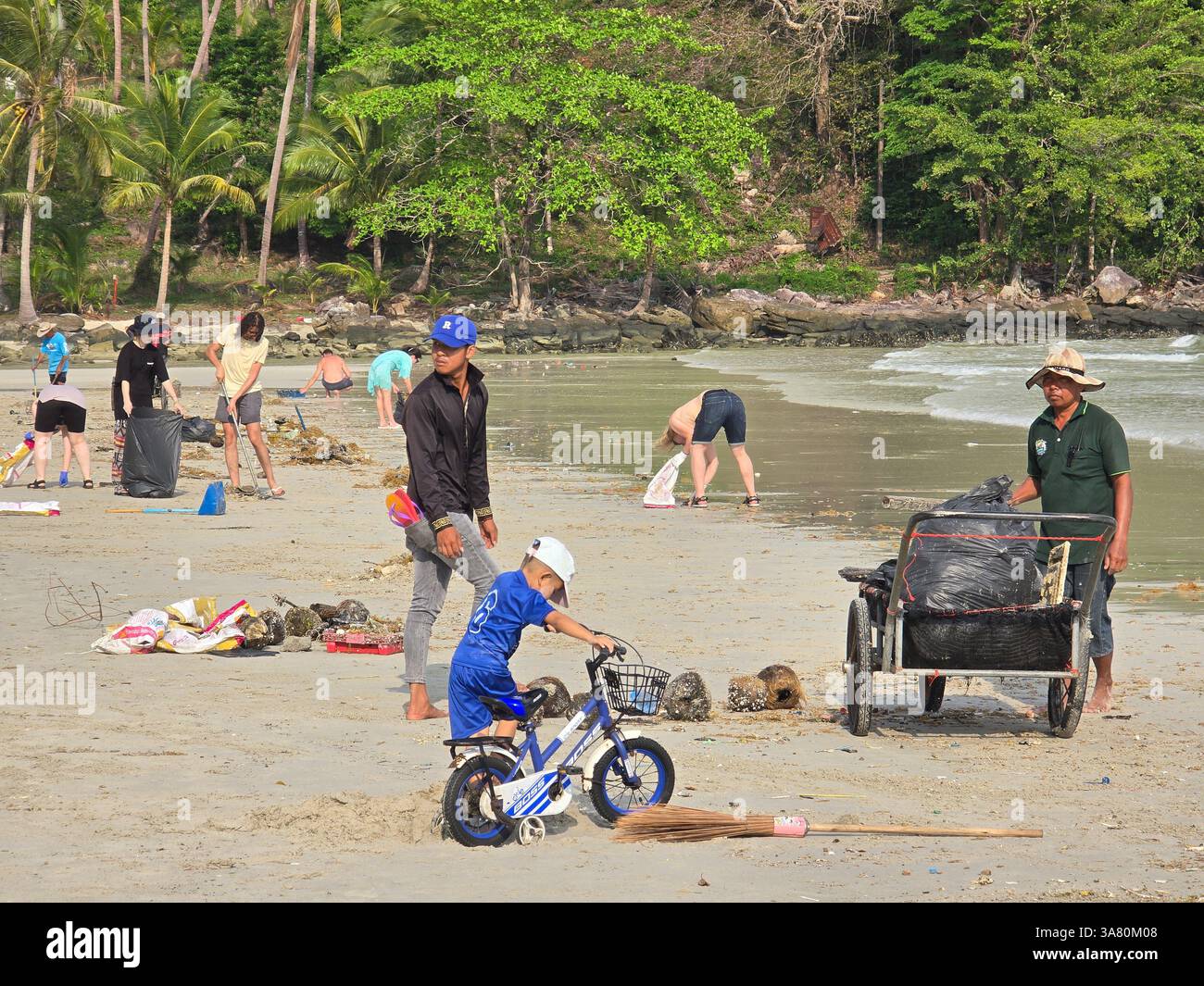 Koh Kood, Thailand, 13 March 2025, Community members gather to clean up the beach, promoting ...