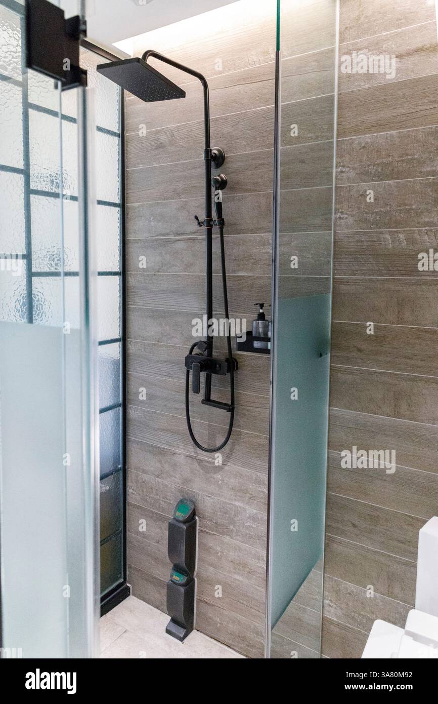 Modern Bathroom with Glass Shower and Gold Fixtures Stock Photo - Alamy