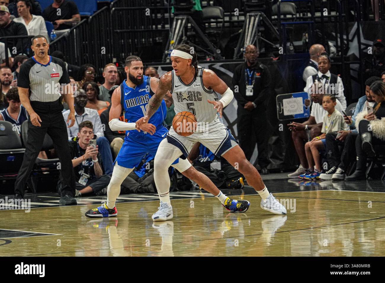 Orlando, Florida, USA, March 27, 2025, Orlando Magic forward Paolo Banchero #5 controls the ball ...