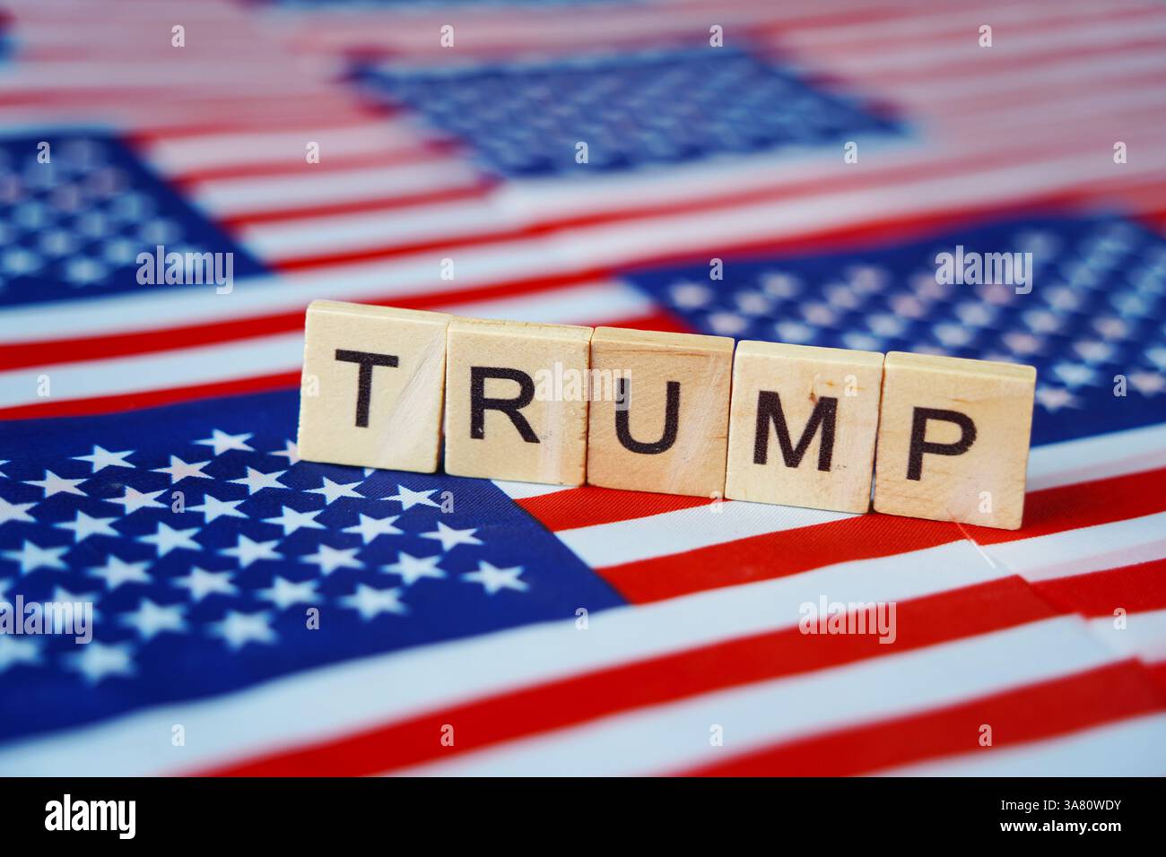 The inscription Trump on the background of US flags Stock Photo - Alamy