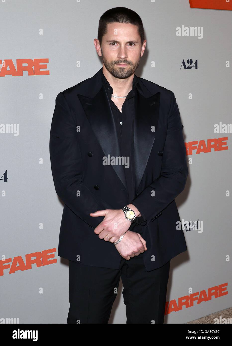 Evan Holtzman arrives at The Los Angeles Red Carpet Premiere of WARFARE ...