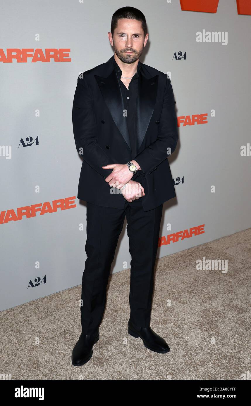 Evan Holtzman arrives at The Los Angeles Red Carpet Premiere of WARFARE ...