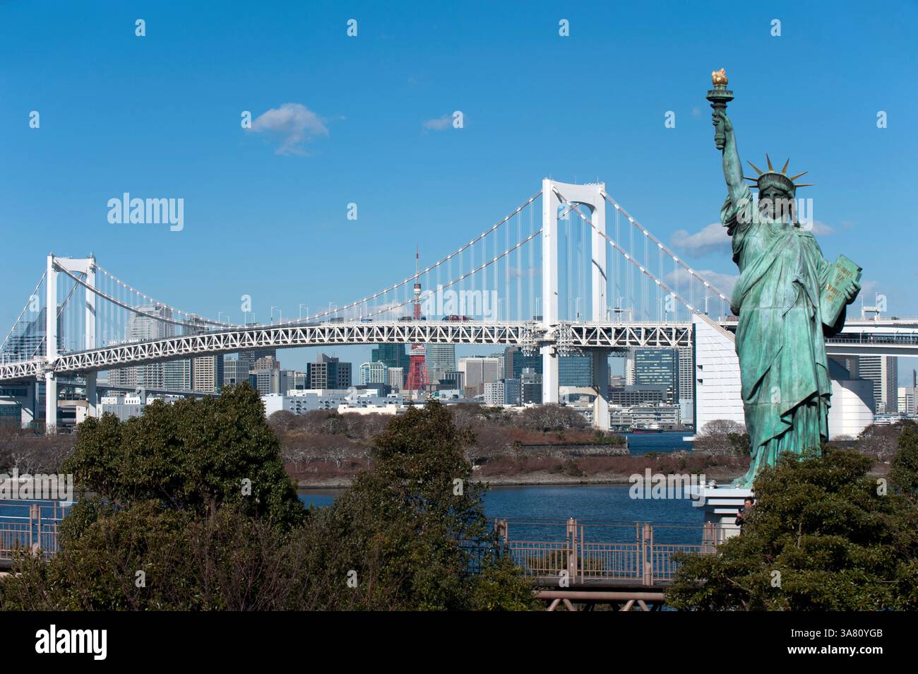 View of Tokyo's Rainbow Bridge from Odaiba where a miniature replica of ...