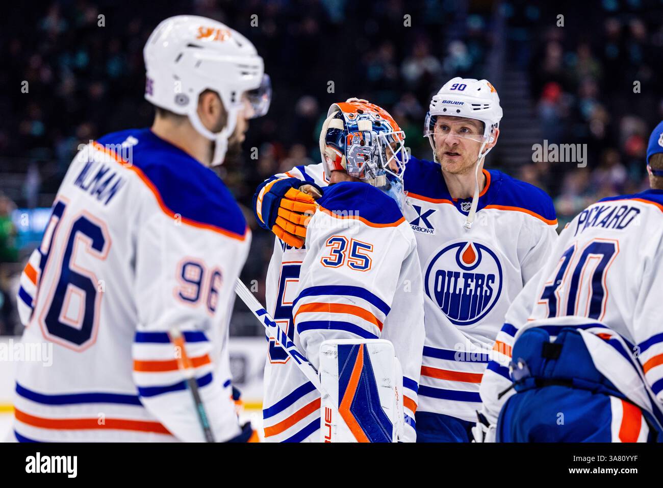 Edmonton Oilers right wing Corey Perry, right, talks with goaltender ...