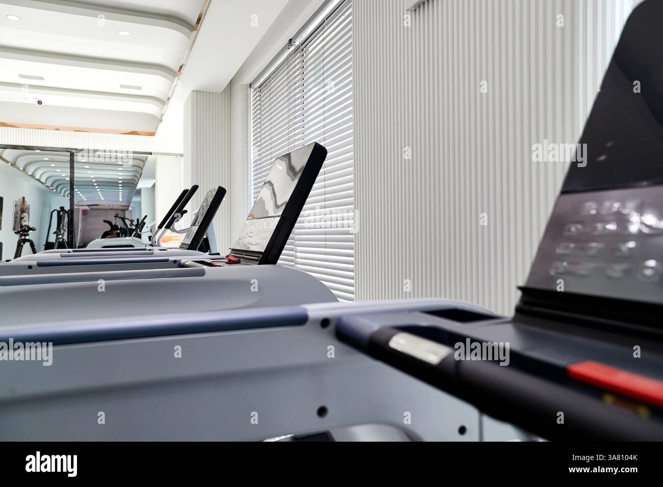 Modern Fitness Center Interior with Treadmills Stock Photo - Alamy