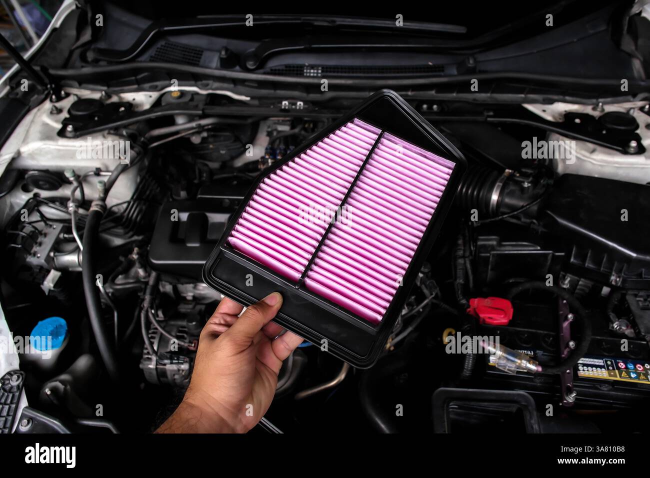 New air filter replacement by auto mechanic in auto repair garage ...