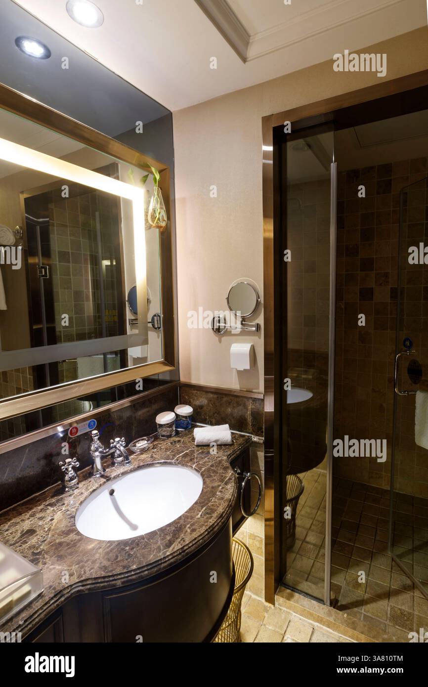 Modern Bathroom with Glass Shower and Gold Fixtures Stock Photo - Alamy