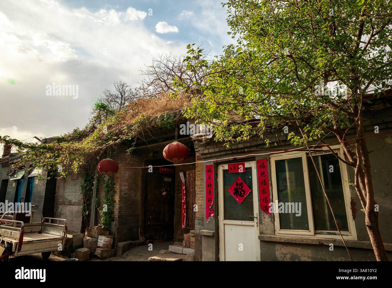 Chinese Entrance with Stone Columns and Wooden Door Stock Photo - Alamy