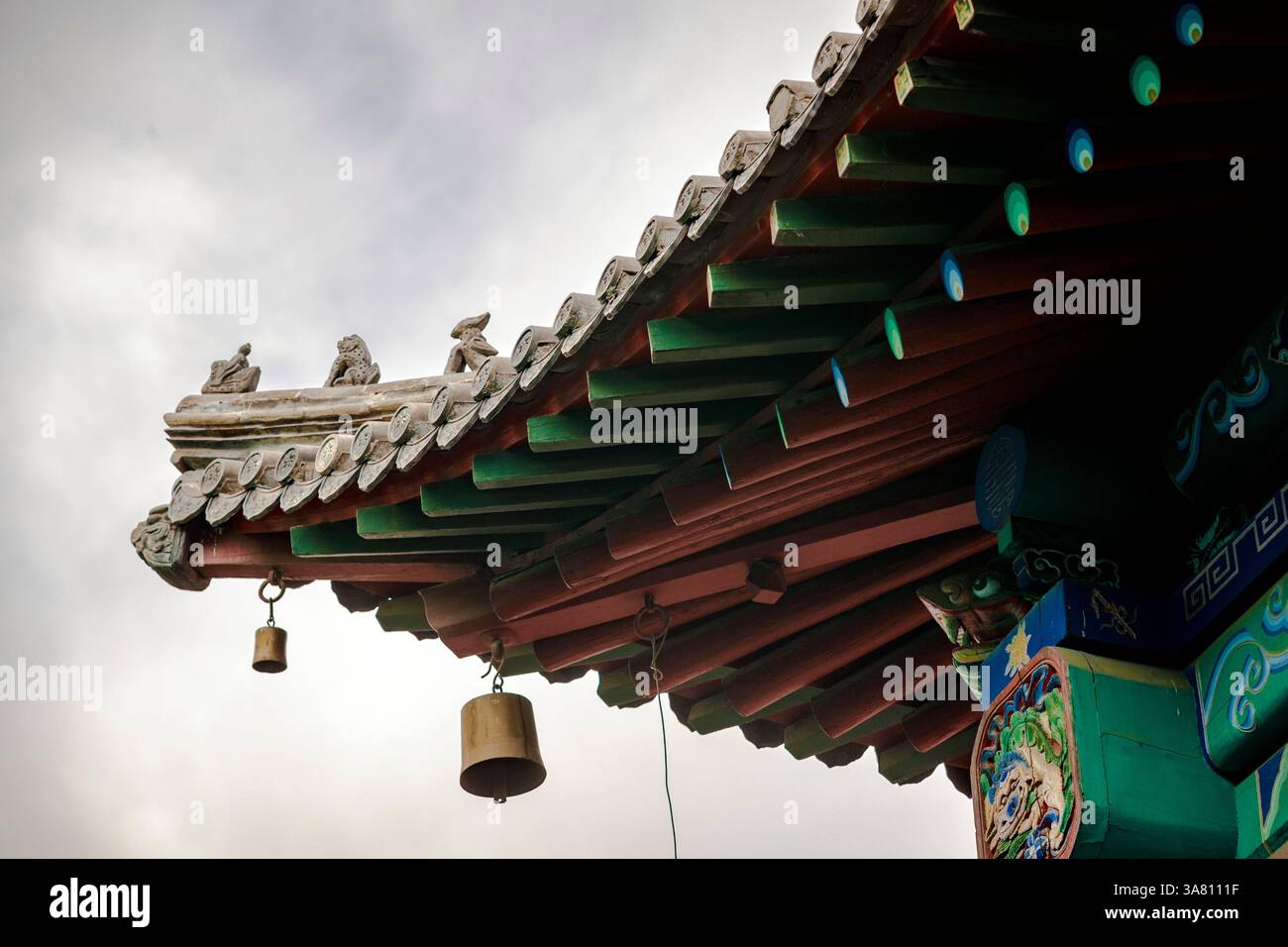 Traditional East Asian Roof with Ornate Carvings and Copper Bell Stock ...