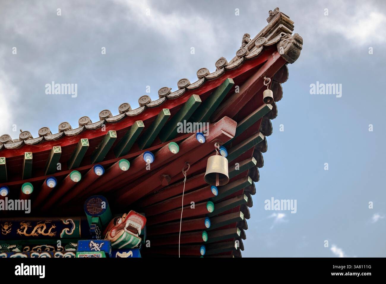 Traditional East Asian Roof with Ornate Carvings and Copper Bell Stock ...
