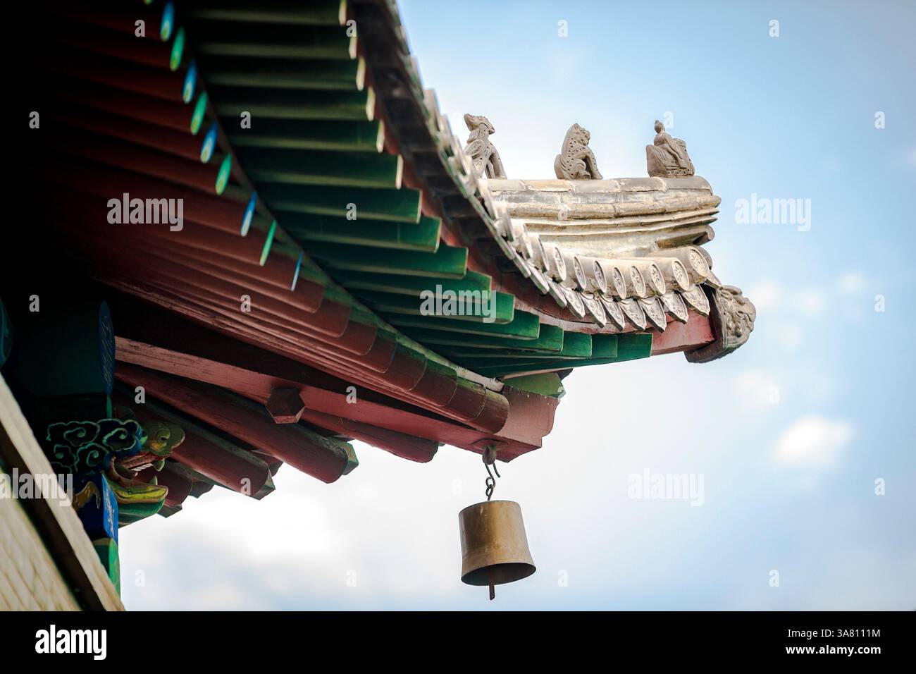 Traditional East Asian Roof with Ornate Carvings and Copper Bell Stock ...