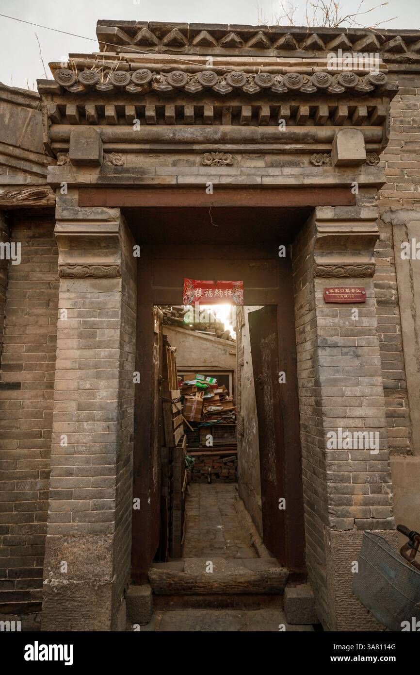Chinese Entrance with Stone Columns and Wooden Door Stock Photo - Alamy
