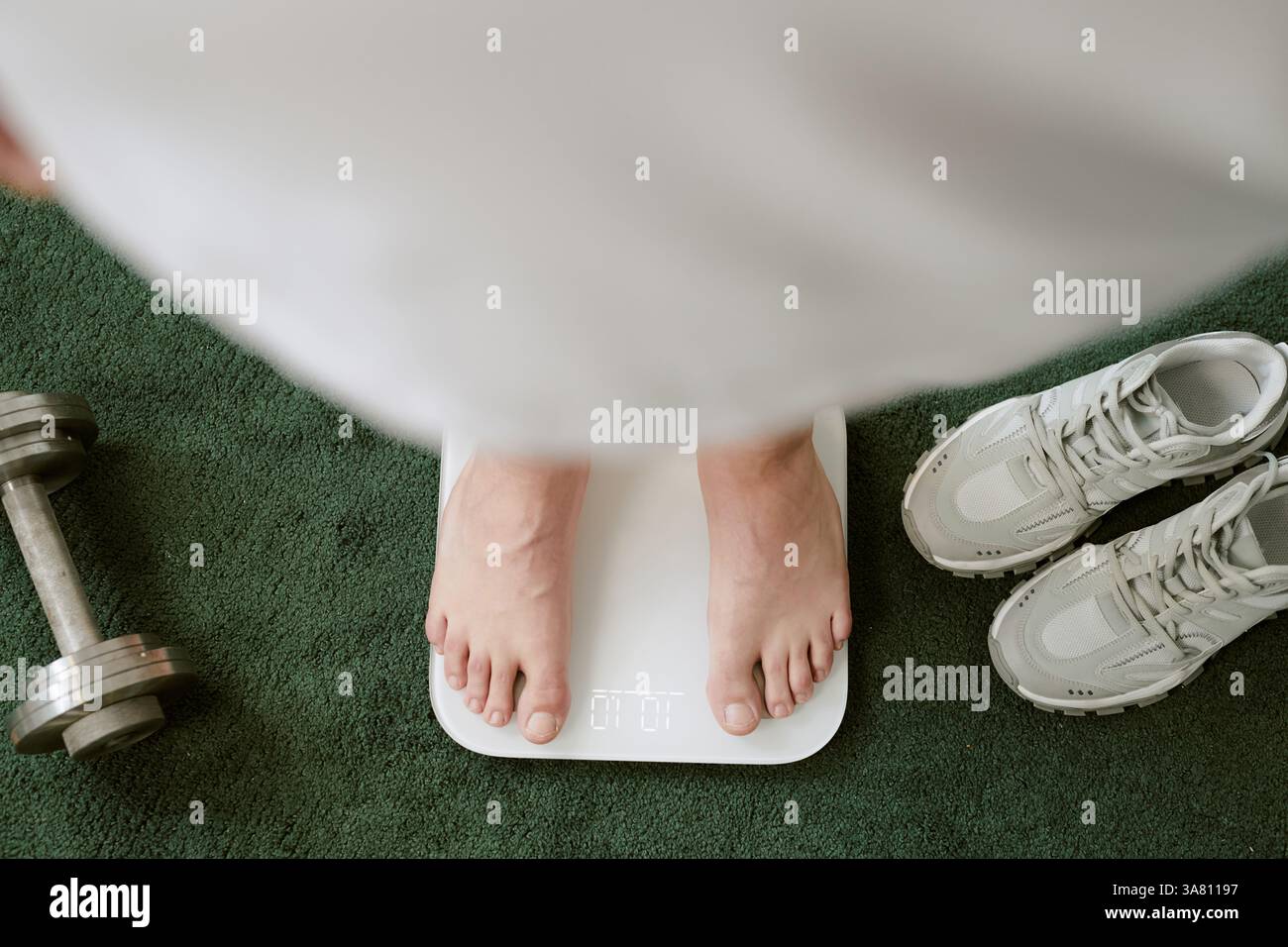 Stepping on Weight Scale during Workout Routine Stock Photo - Alamy