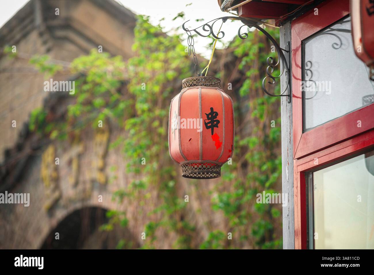 Traditional Chinese Lantern and Vine-Covered Architecture Stock Photo ...