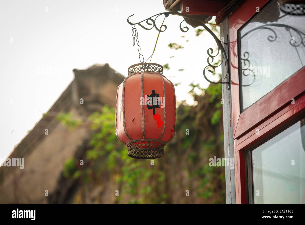 Traditional Chinese Lantern and Vine-Covered Architecture Stock Photo ...