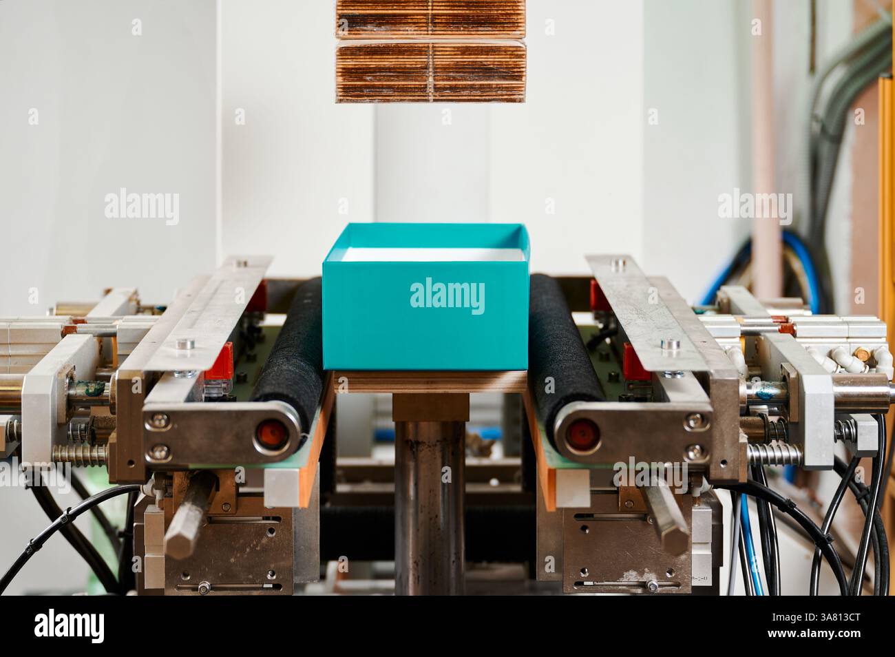 Efficient machine automates the wrapping process of rectangular boxes ...