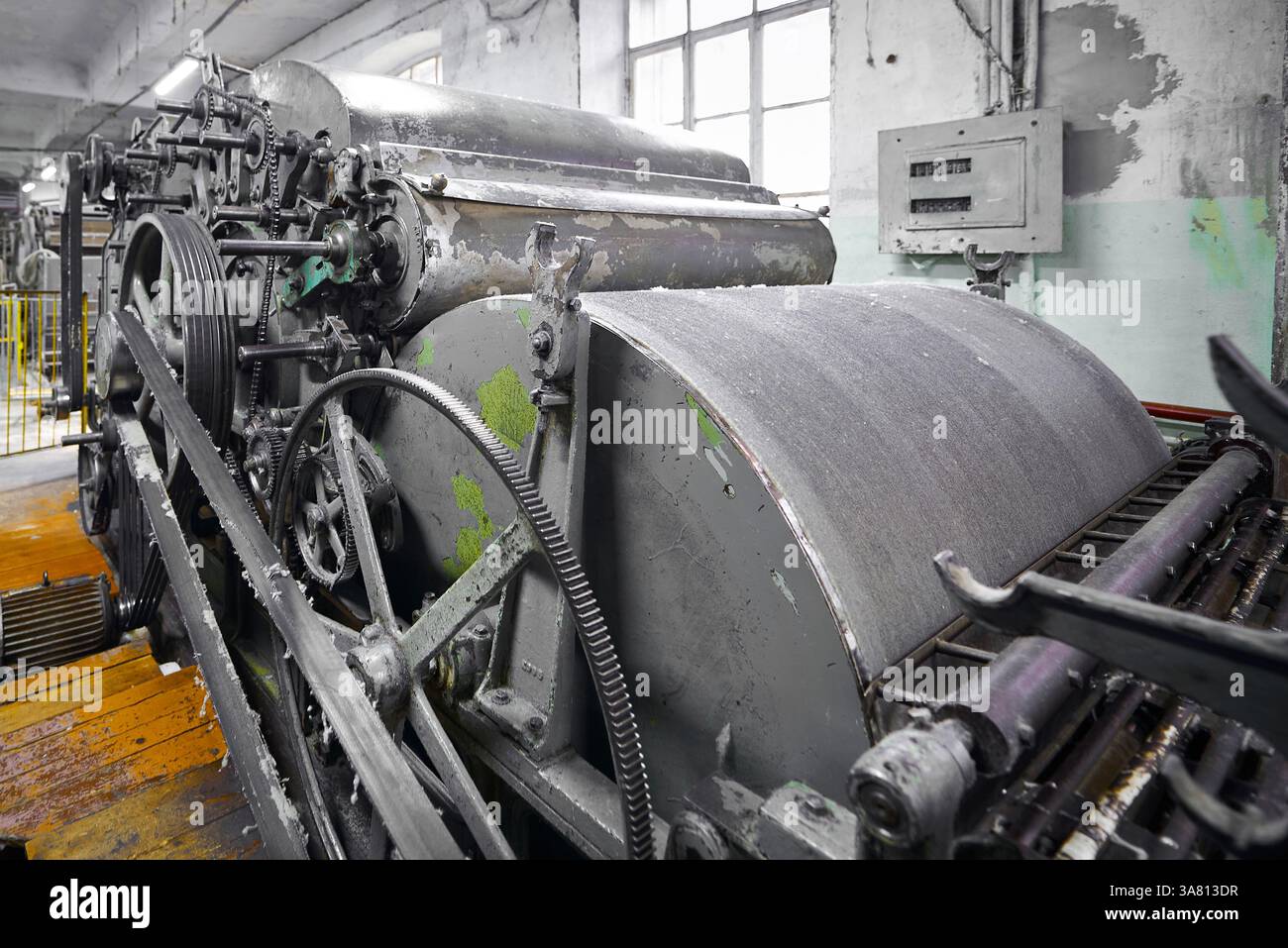 Vintage carding machine illustrating early textile production ...