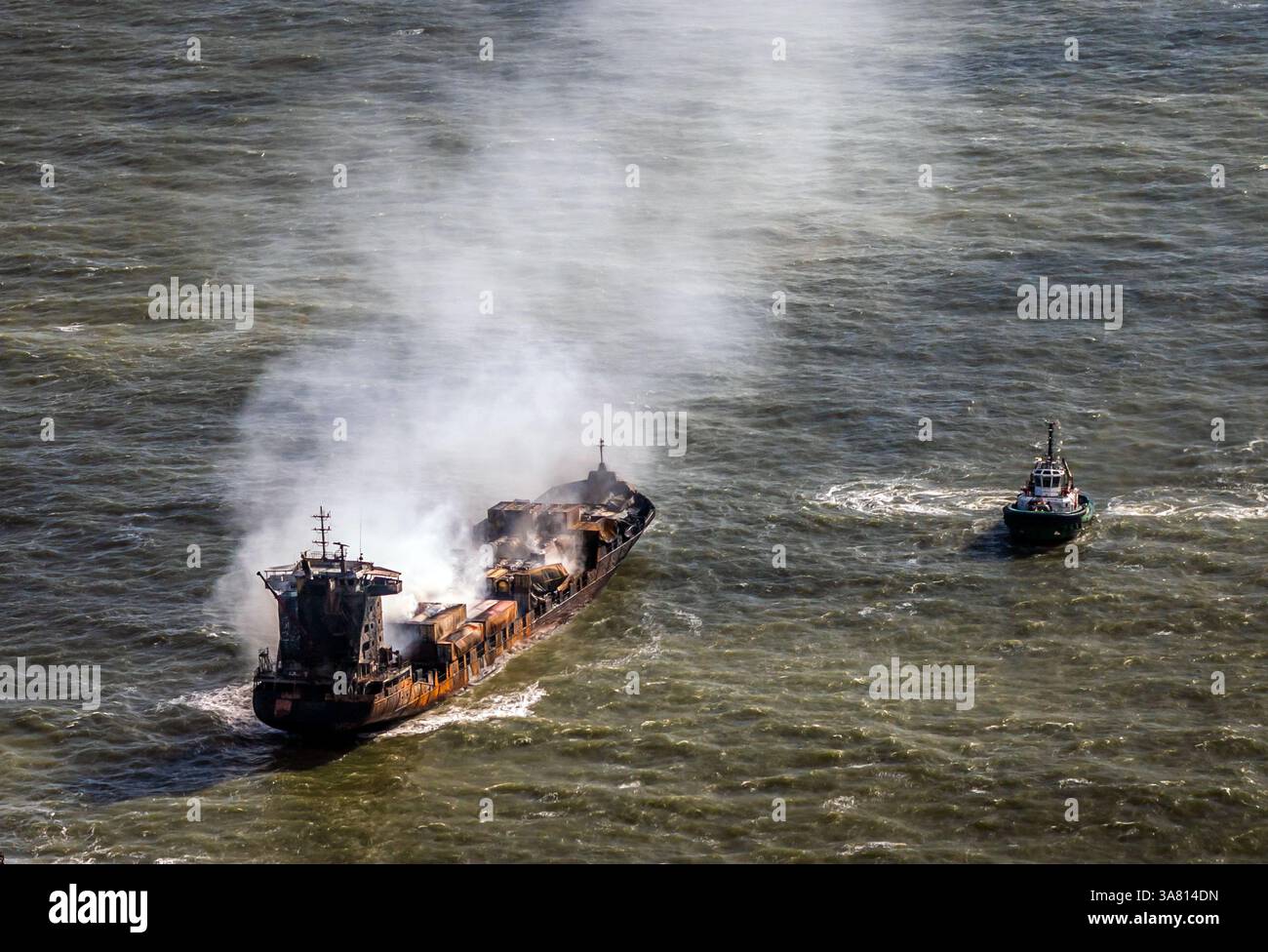 File photo dated 11/03/25 of tugboats shadowing the Solong container ...