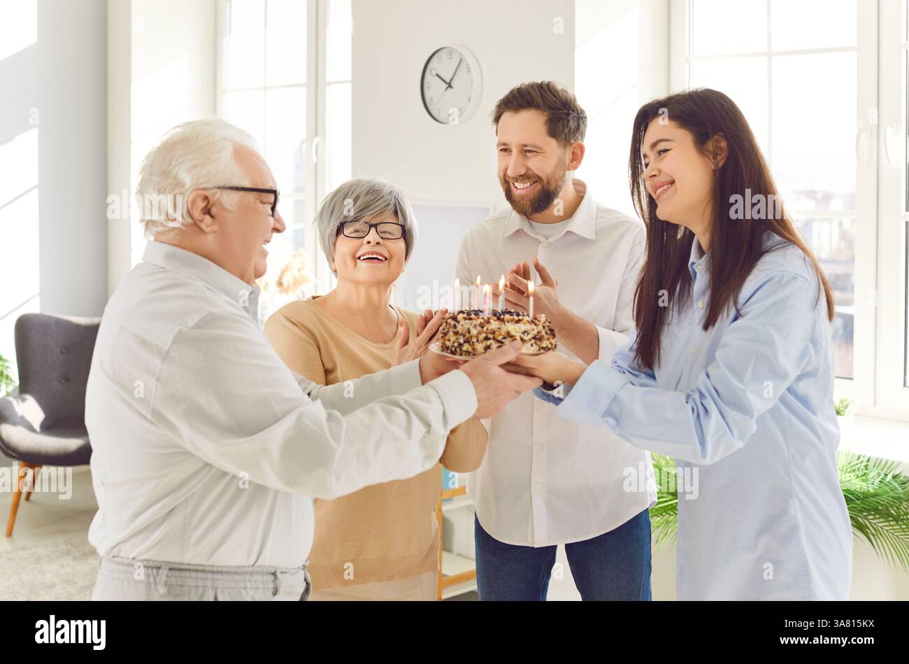 Happy family, aging old parents and adult children, two generations ...