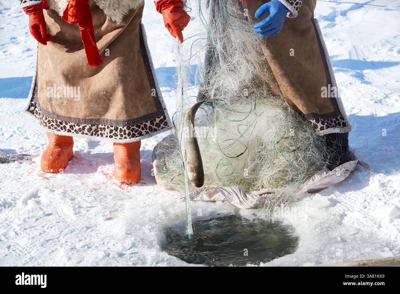 Winter Ice Fishing Scene with Fish in Net Stock Photo - Alamy