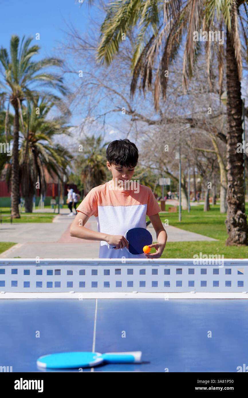 education, children and sports concept. ping pong. preteen boy playing ...