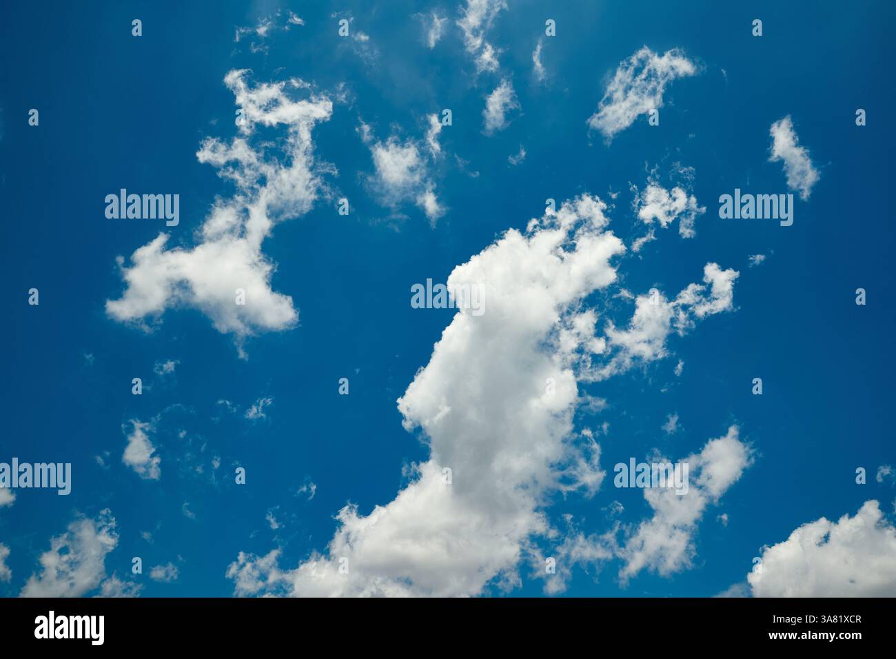 Blue Sky with Fluffy White Clouds Stock Photo - Alamy