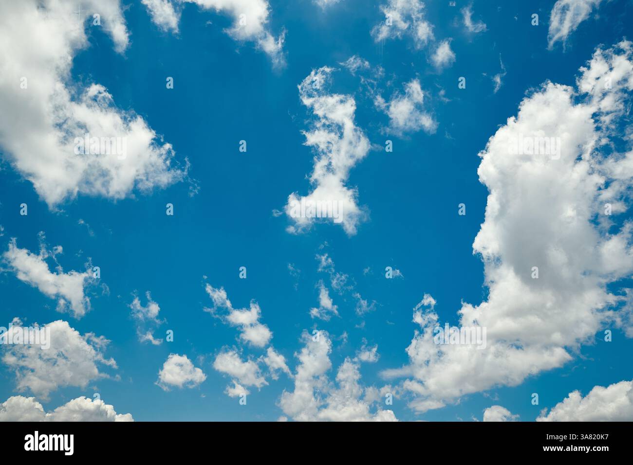 Blue Sky with Fluffy White Clouds Stock Photo - Alamy