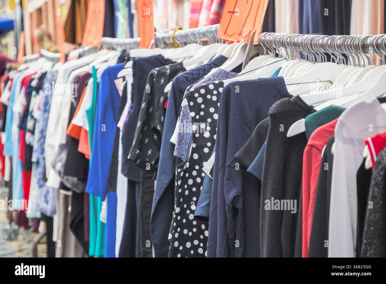 Women vintage dress hanging on rail at Brick Lane market in London ...