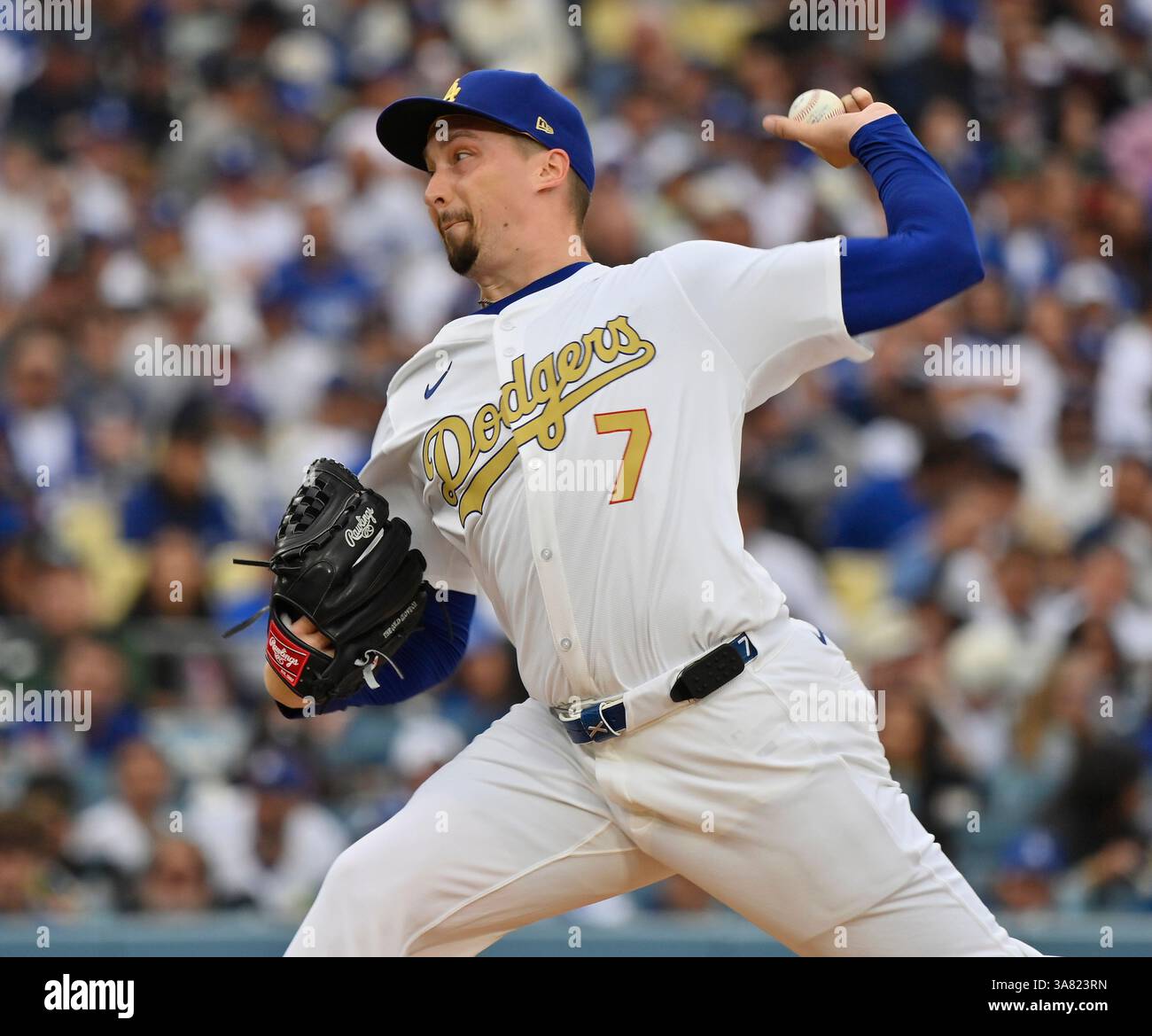 Los Angeles Dodgers starting pitcher Blake Snell winds up to deliver in ...