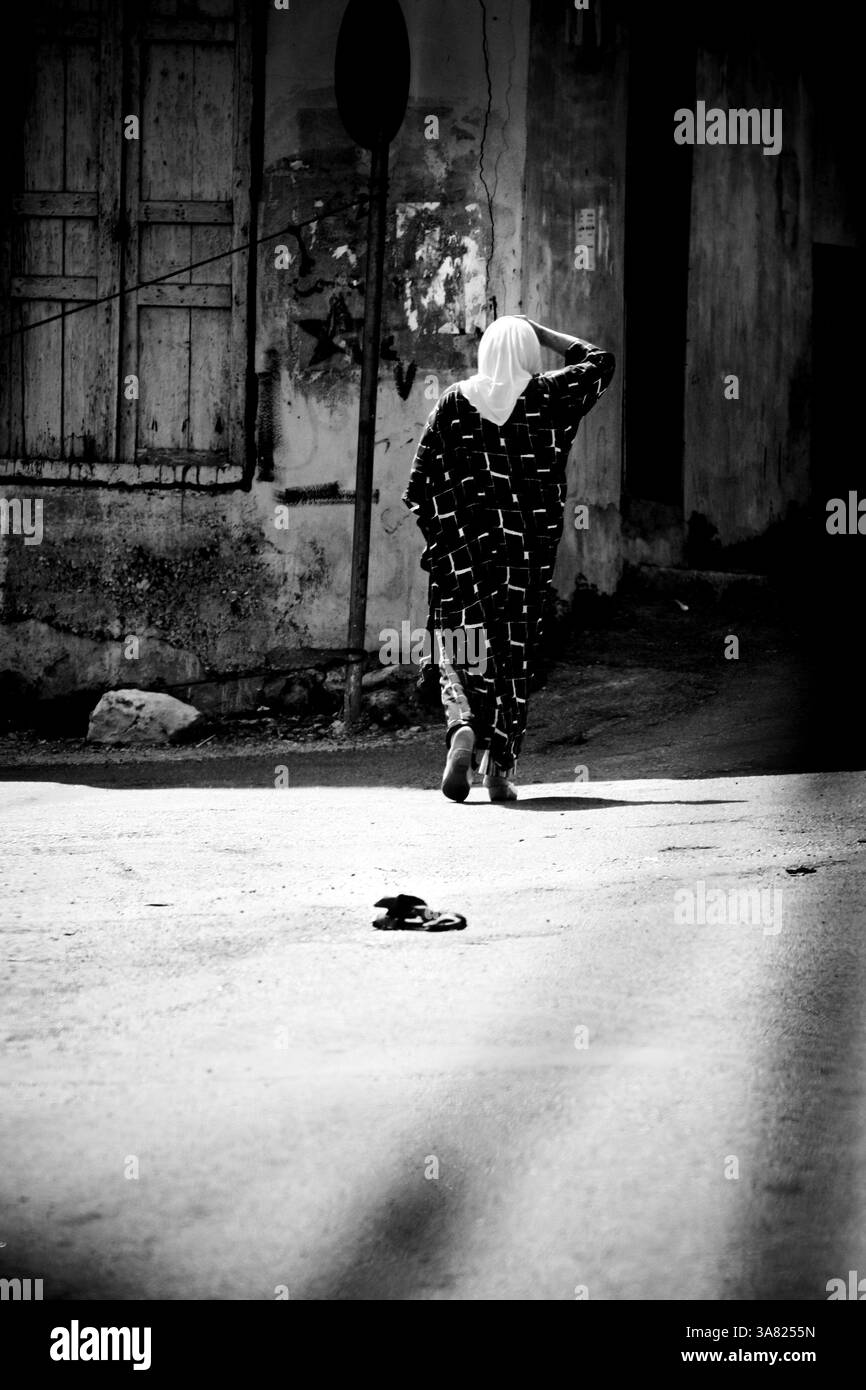 Aug. 12, 2010 - Chamaa, Lebanon - Woman running for repair during a ...