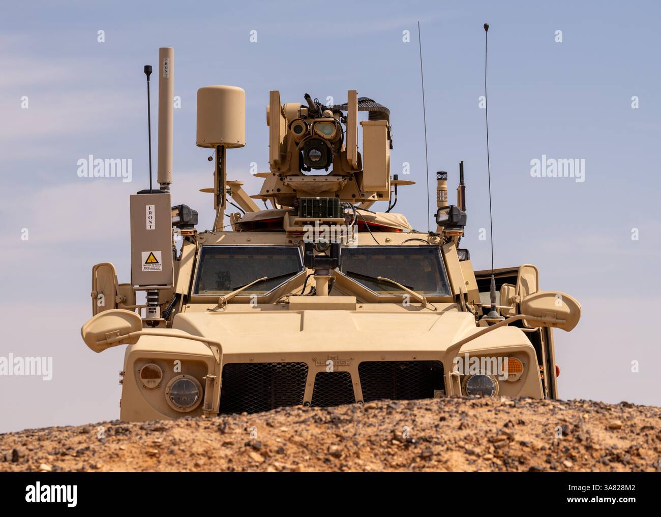 A U.S. Army armored vehicle with a mounted .50 caliber machine gun is ...