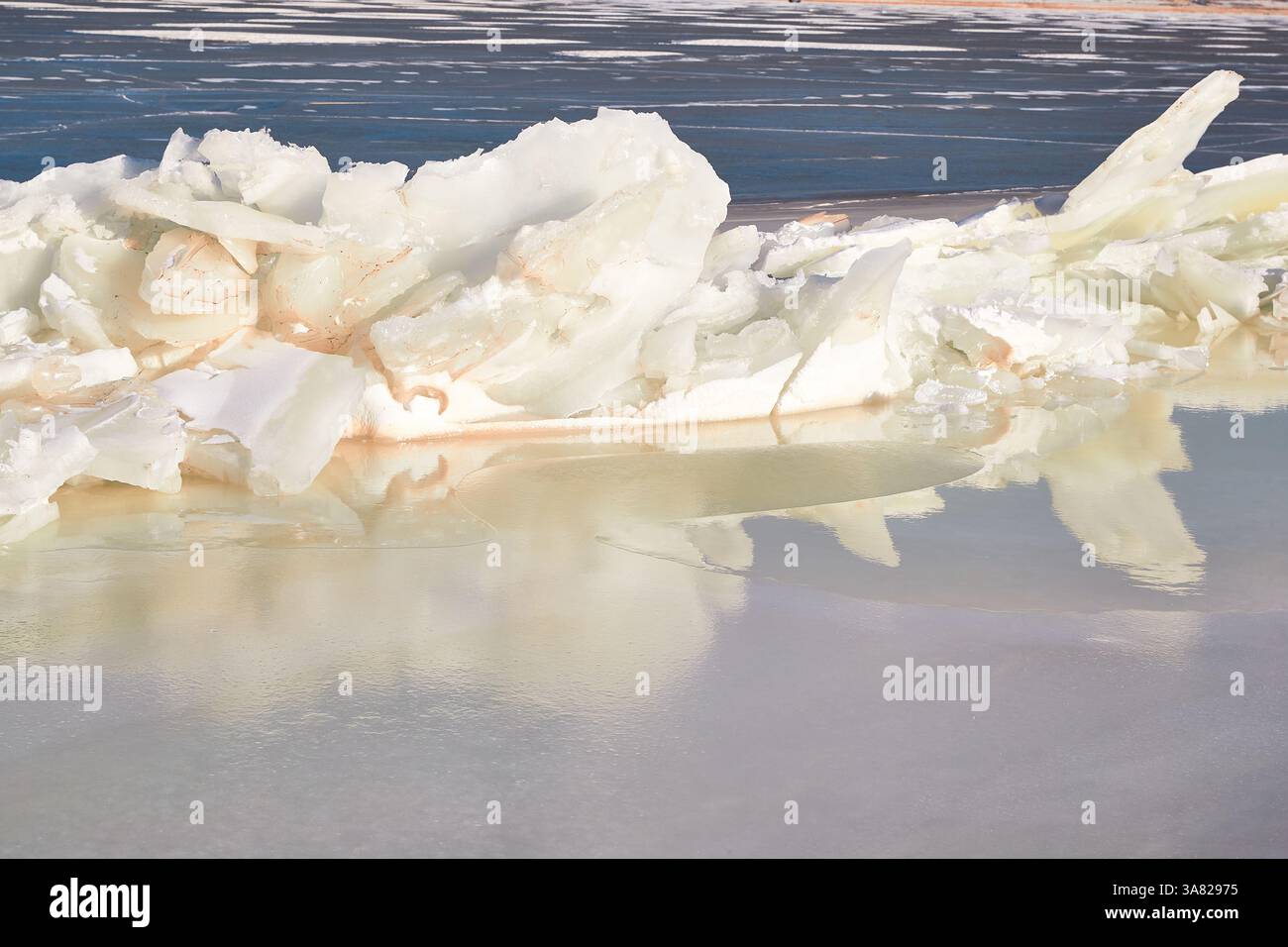 Melting Ice Edge on Blue Sky Background Stock Photo - Alamy