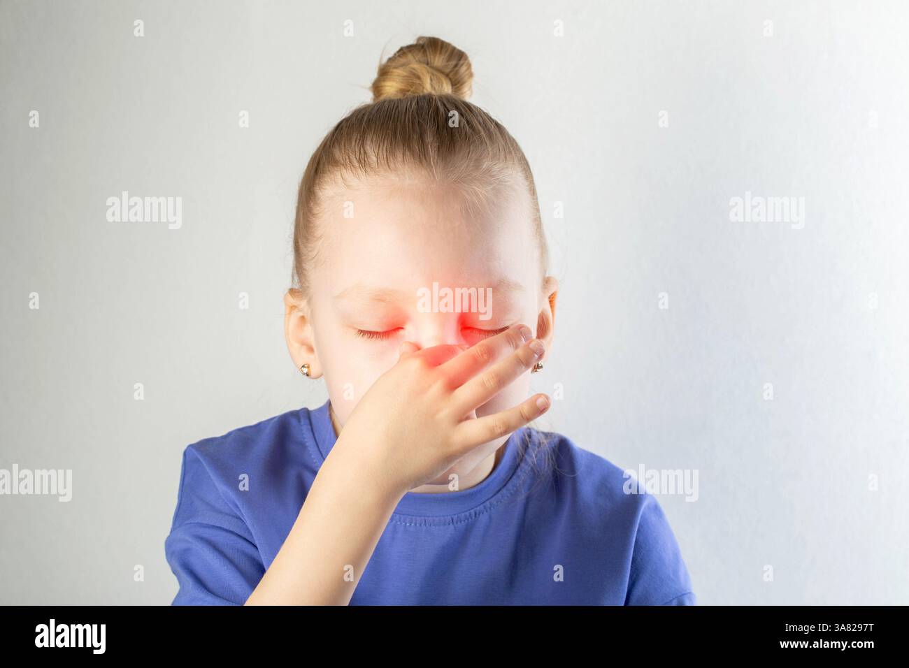 The girl holds her forehead with her hands, pain in her head. The ...