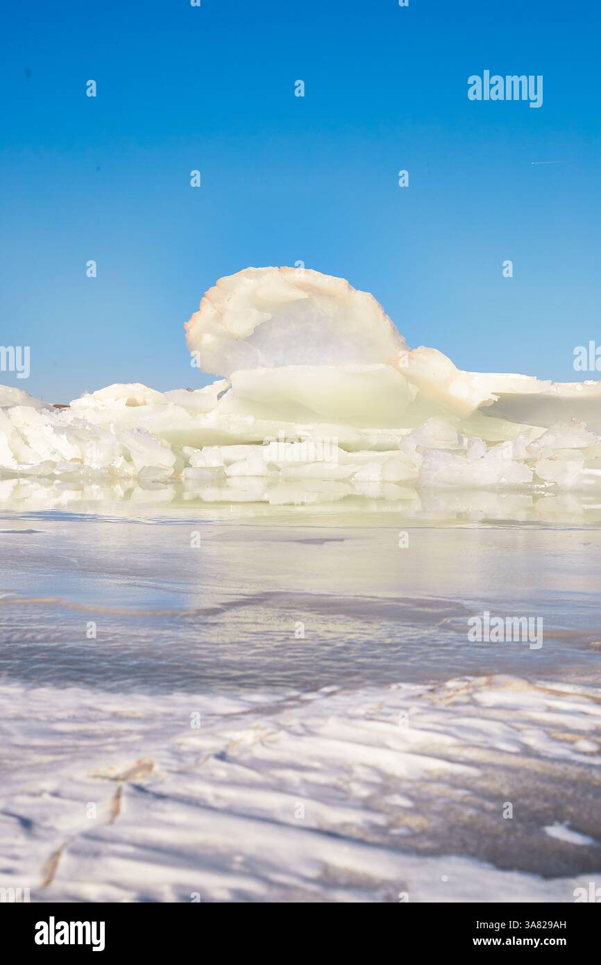 Melting Ice Edge on Blue Sky Background Stock Photo - Alamy