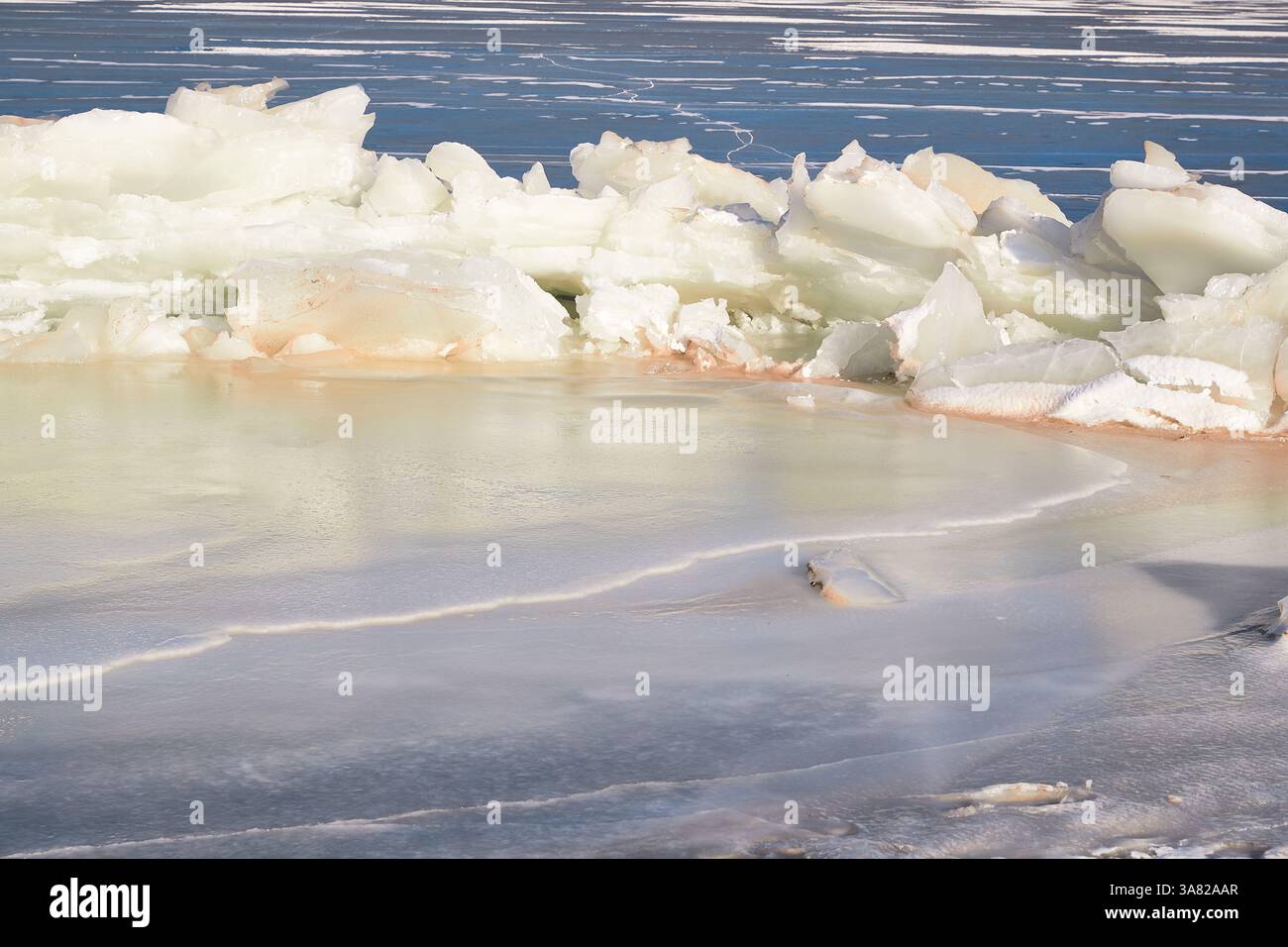 Melting Ice Edge on Blue Sky Background Stock Photo - Alamy