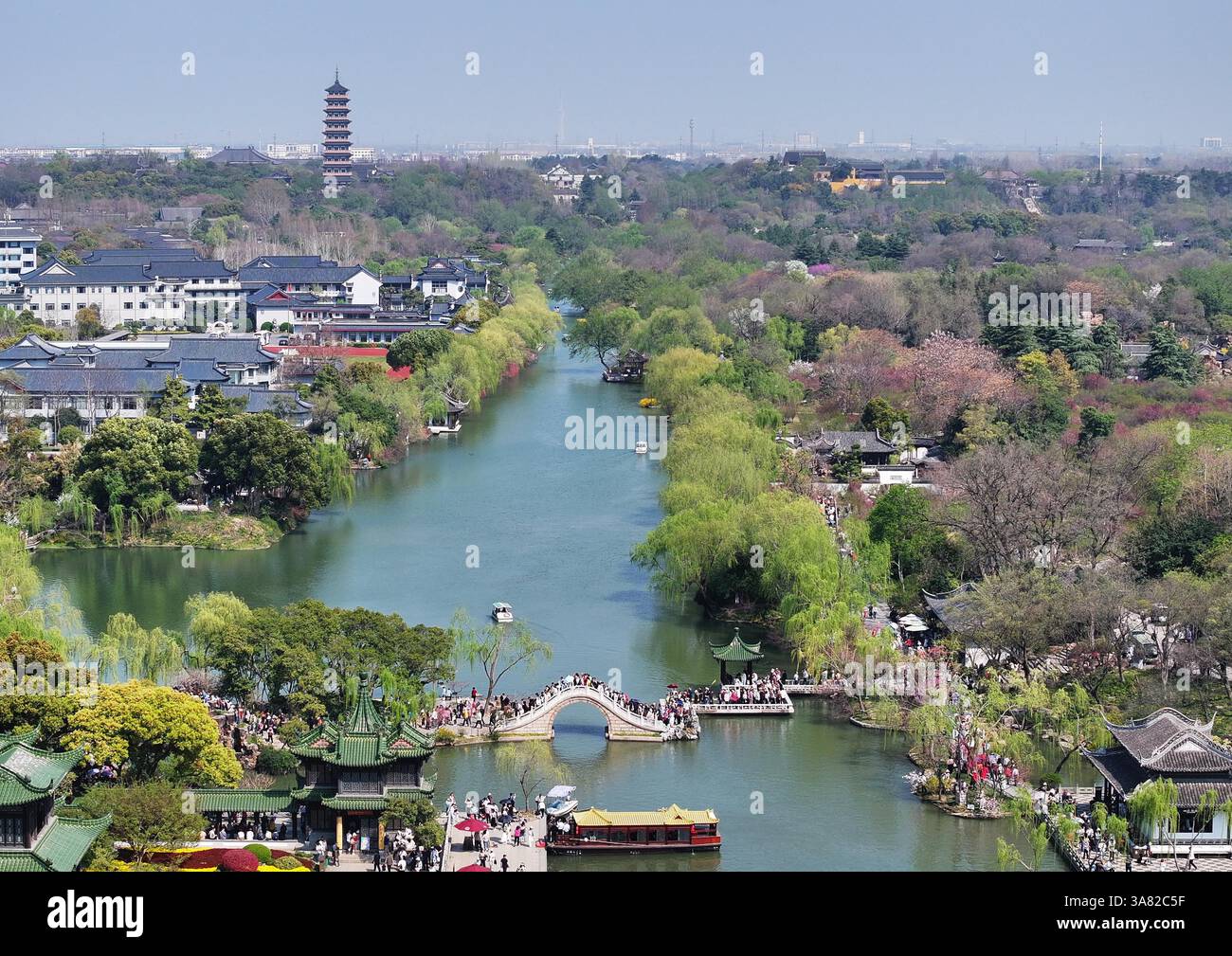 Aerial photo shows tourists admiring spring scenery at the Slender West ...