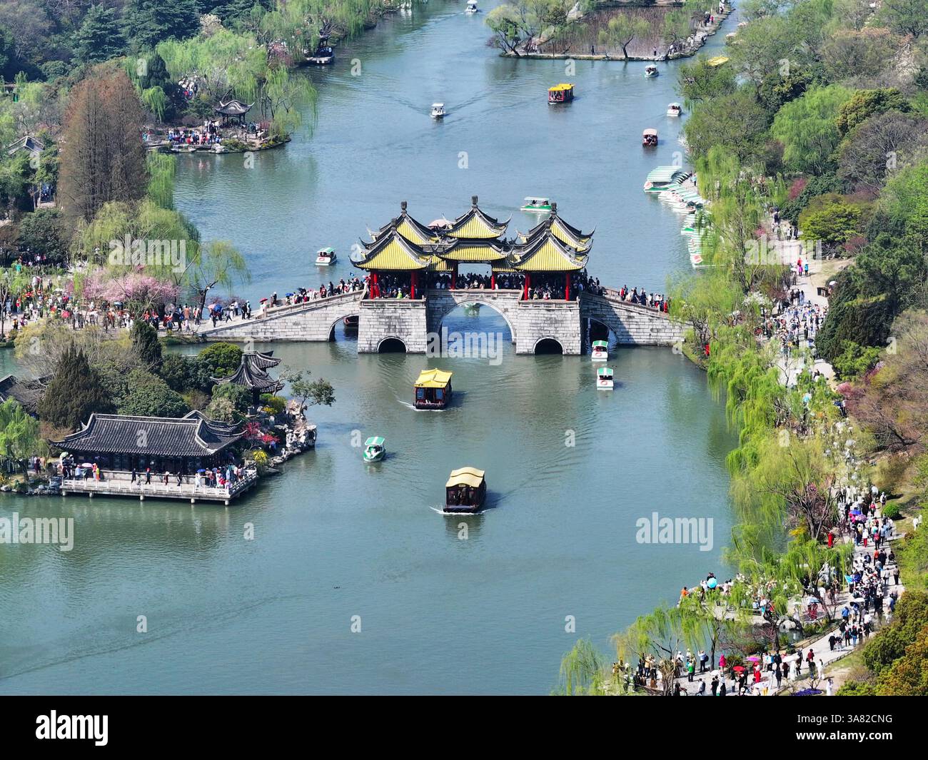 Aerial photo shows tourists admiring spring scenery at the Slender West ...
