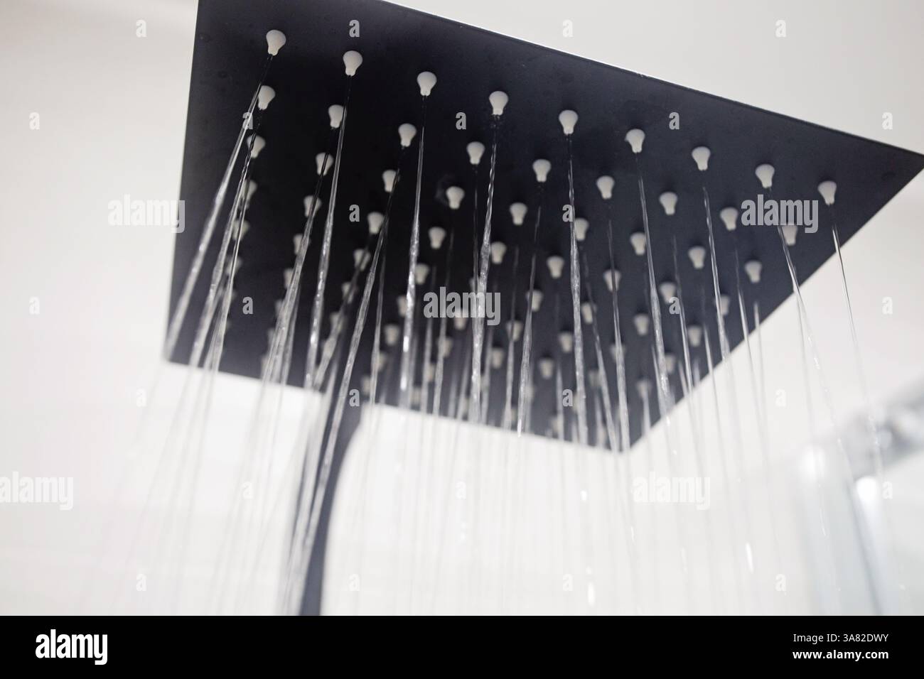 Water running from shower head and faucet in the bathroom Stock Photo ...