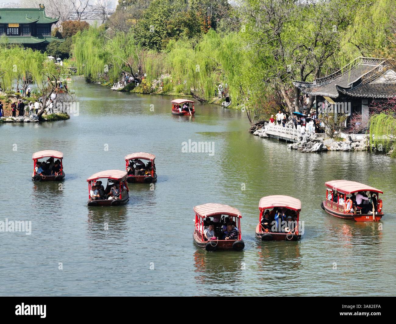 Aerial photo shows tourists admiring spring scenery at the Slender West ...