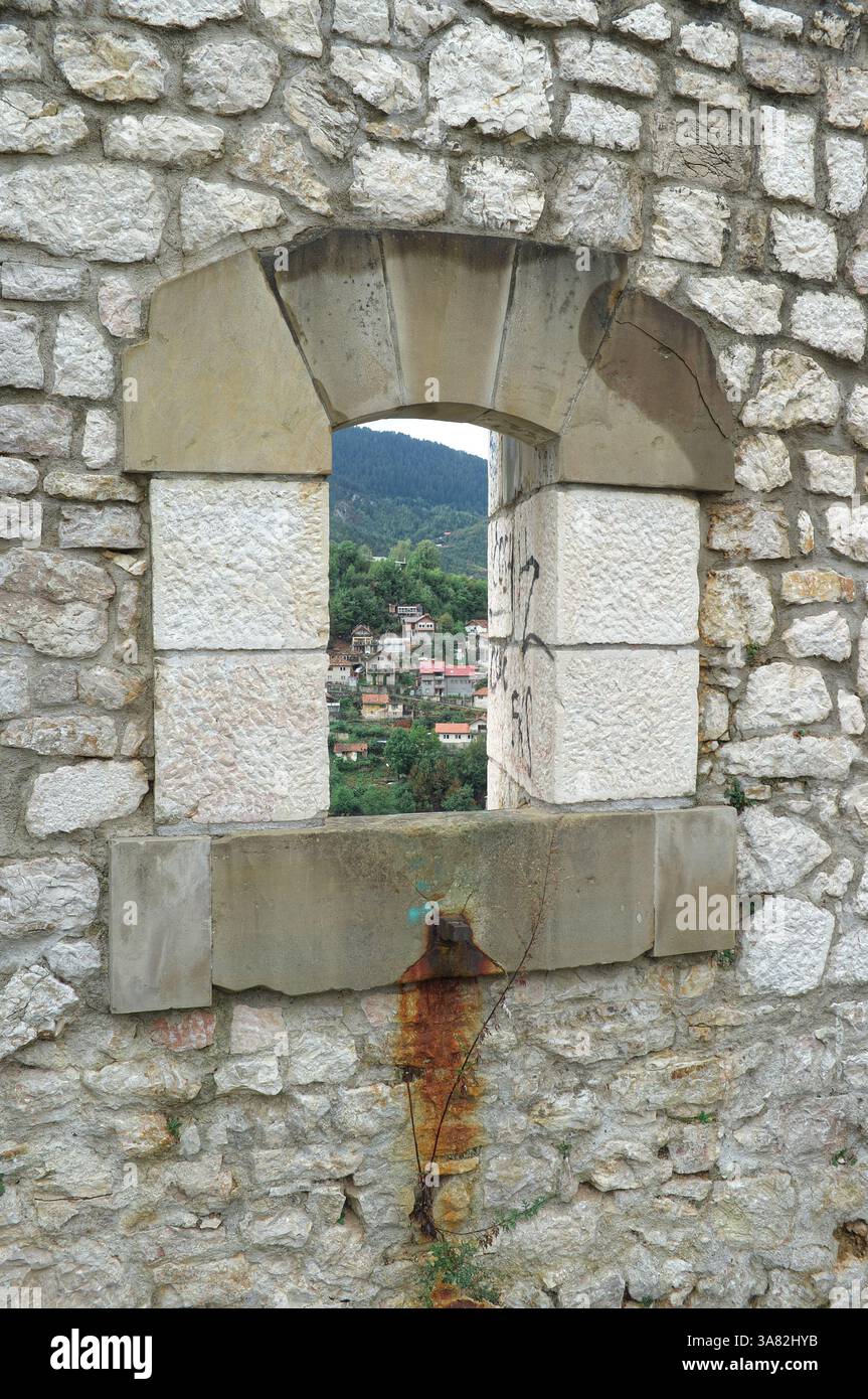 arched window with keystone in a stone wall of White Fortress, Old ...
