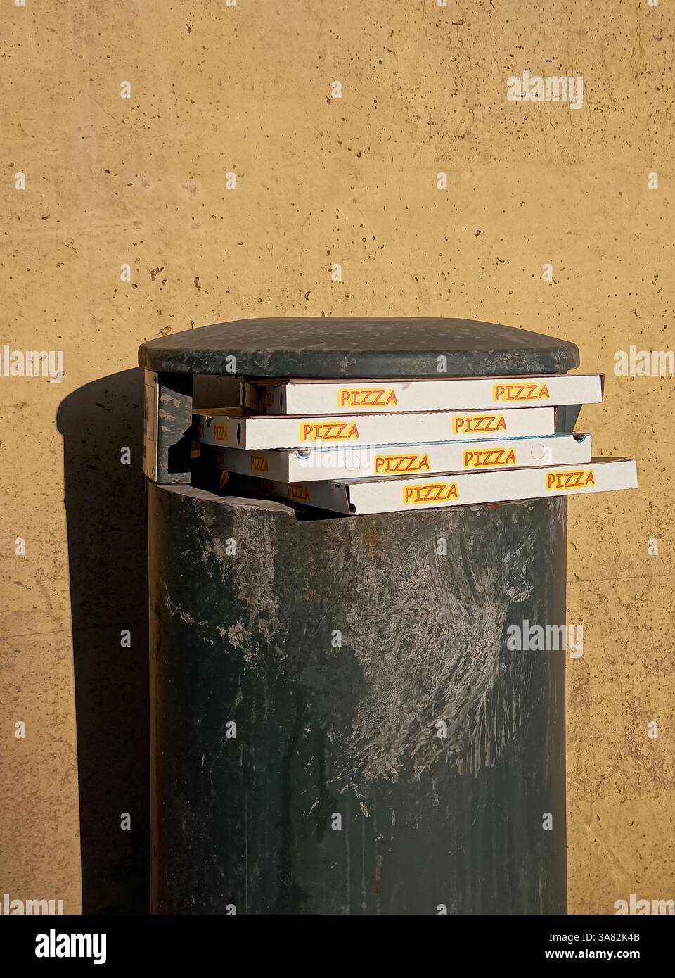 Empty Pizza boxes in a public trash can in the street Stock Photo - Alamy
