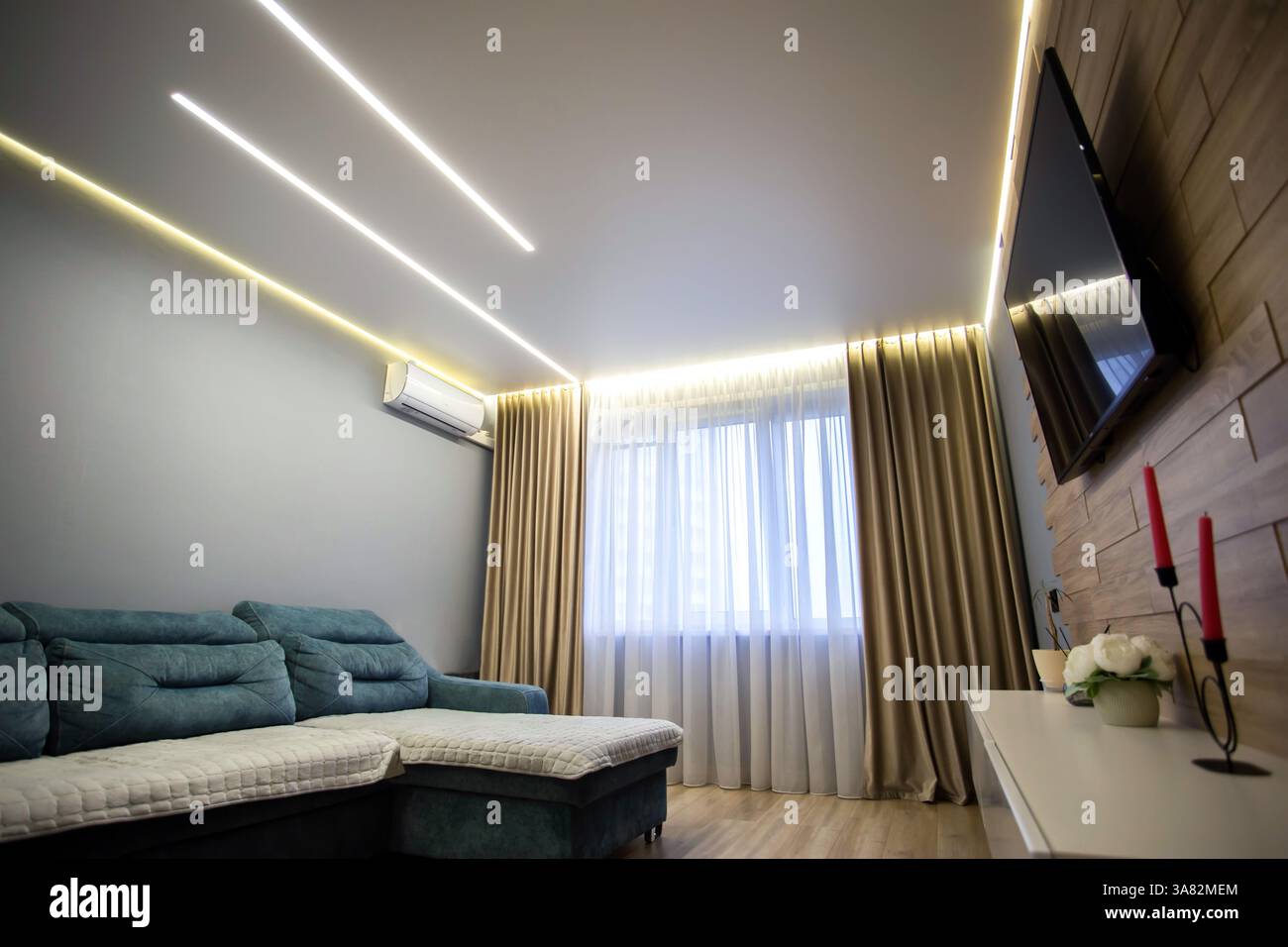 Modern interior in the living room with wooden laminate flooring, wall ...