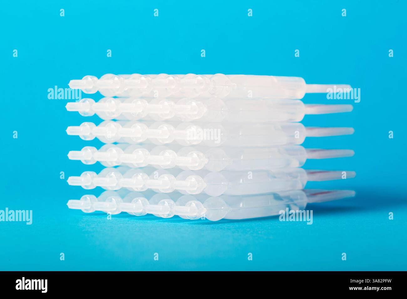 Tubes with medicine on a blue background. Concept of a laxative for the ...