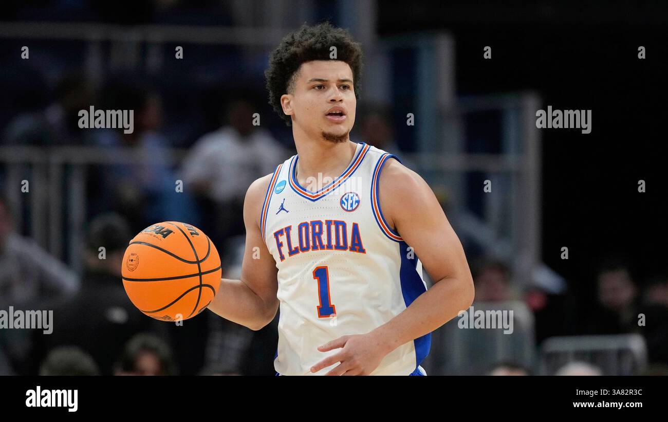 Florida guard Walter Clayton Jr. (1) controls the ball during the first ...
