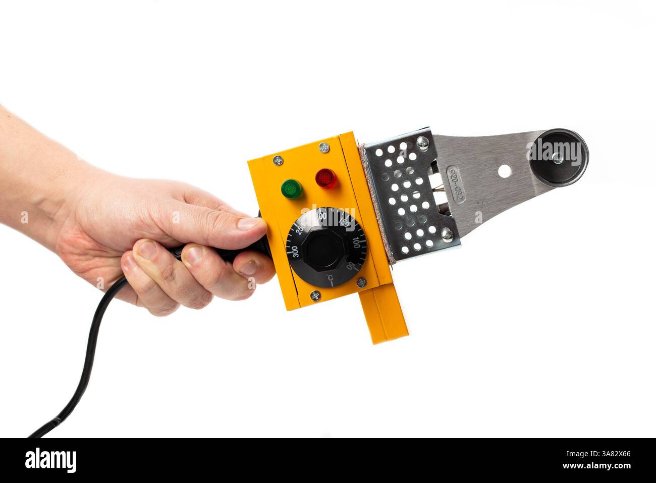 Electric soldering iron for soldering pipes in hand on a white ...