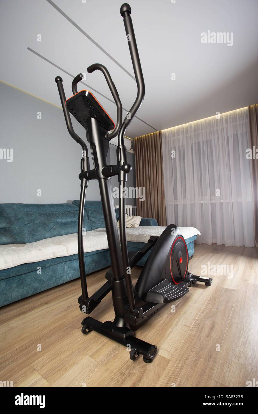 New modern elliptical trainer at home in the exercise room Stock Photo ...