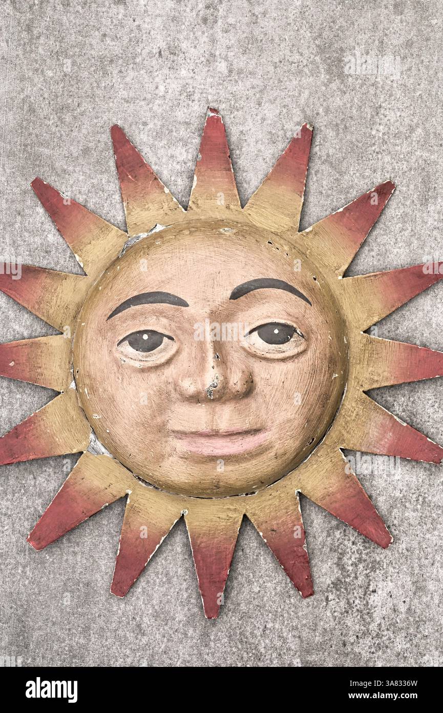 Tin model of sun with rays and sad face in subdued colours Stock Photo ...